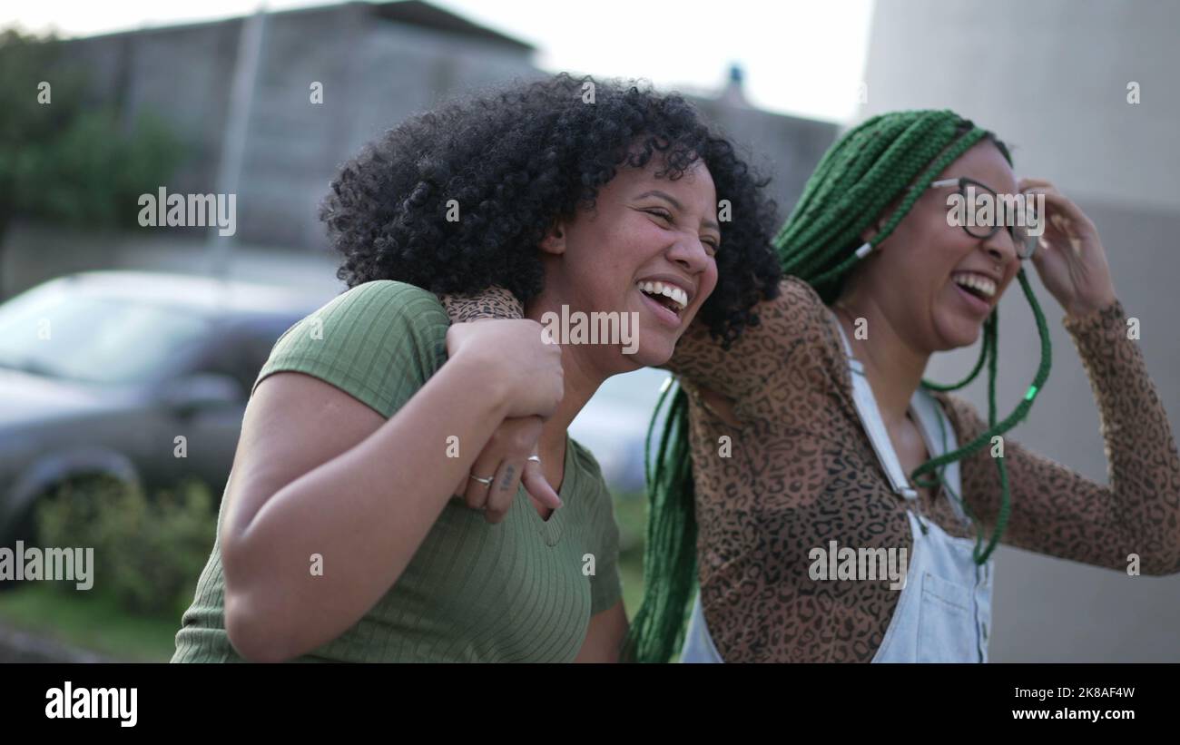 Two happy black Brazilian women celebrating life together. South ...