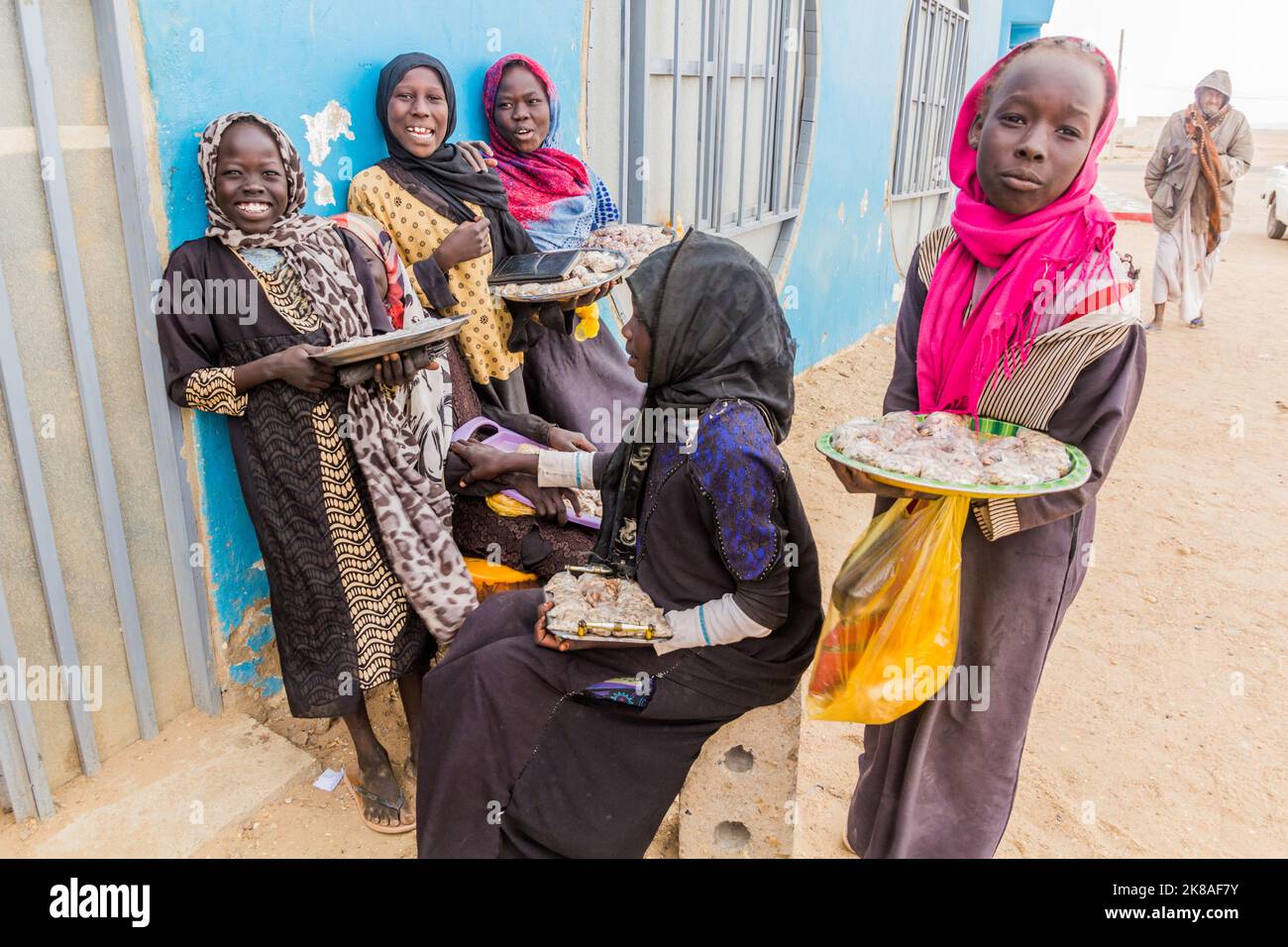 ABRI, SUDAN - FEBRUARY 27, 2019: Young peanut sellers at a petrol ...