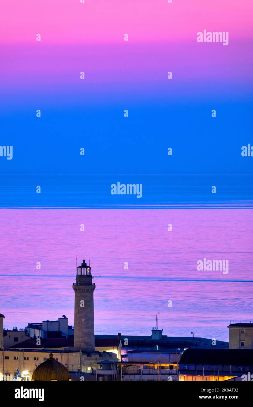 The "Lanterna di Trieste" lighthouse at sunset, Trieste, Italy Stock ...