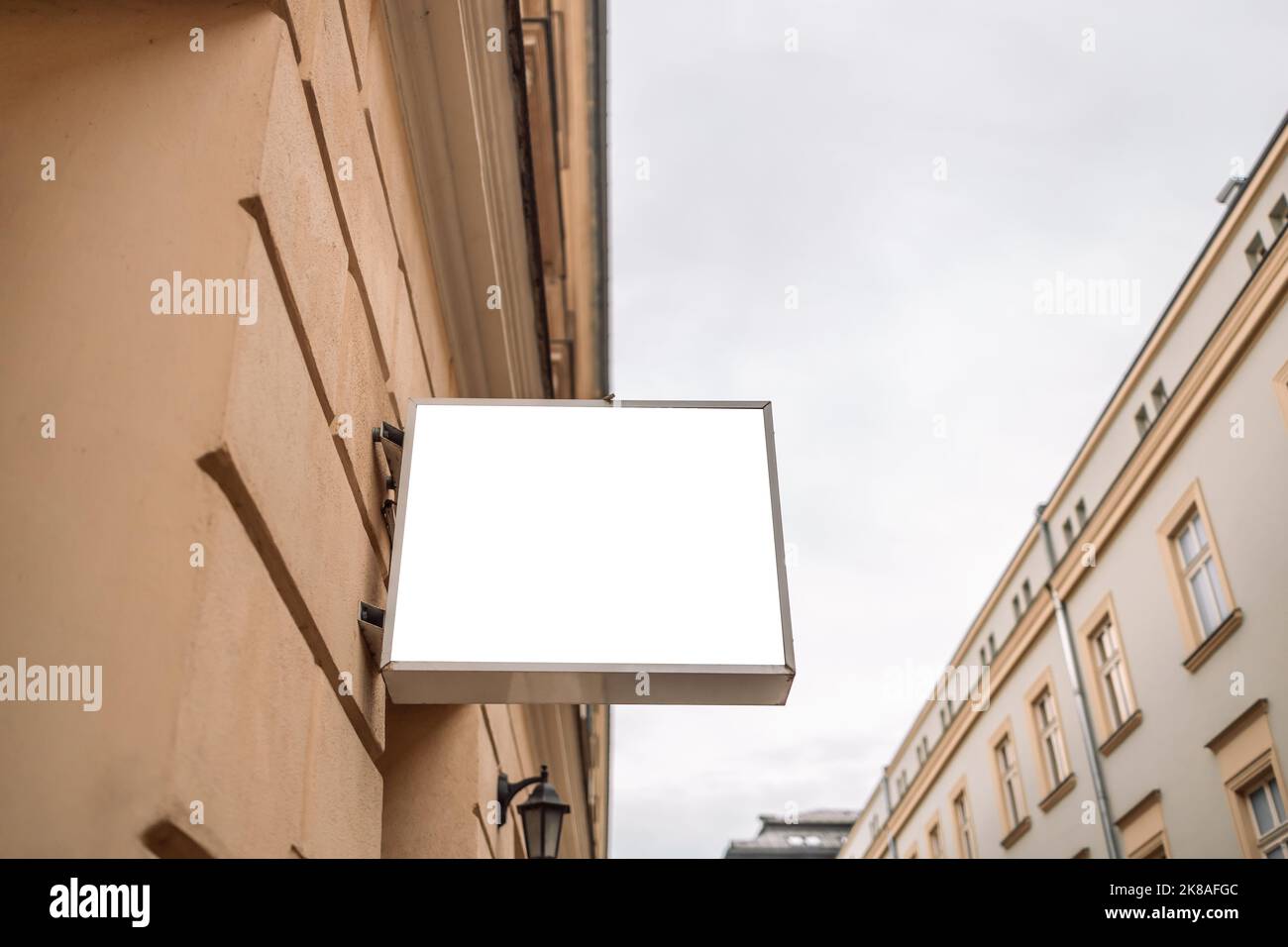 Blank sign outside a shop or restaurant with copy space in old city ...