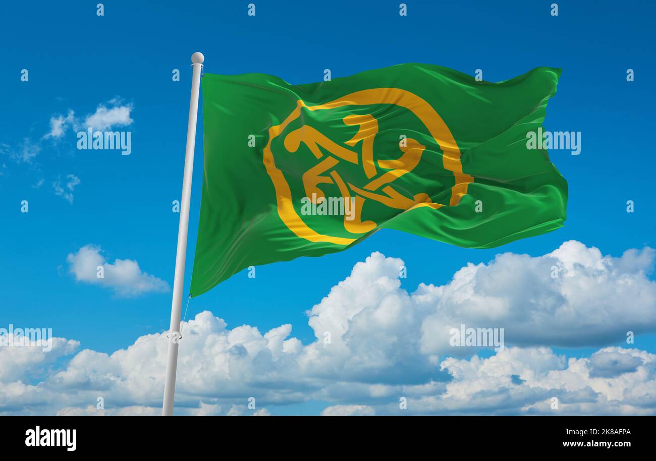 flag of Celtic peoples Pan-Celtic at cloudy sky background, panoramic ...