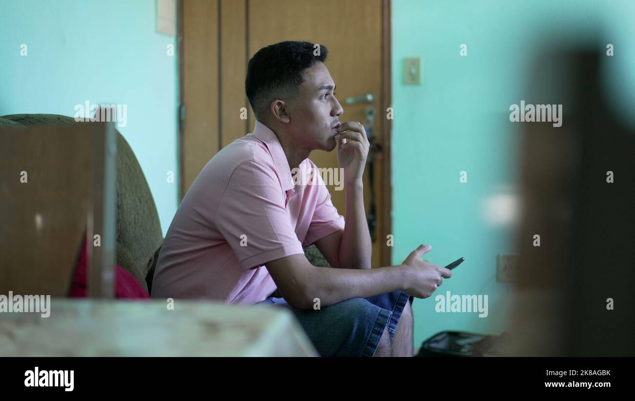 One pensive hispanic young man thinking at home A south american person ...