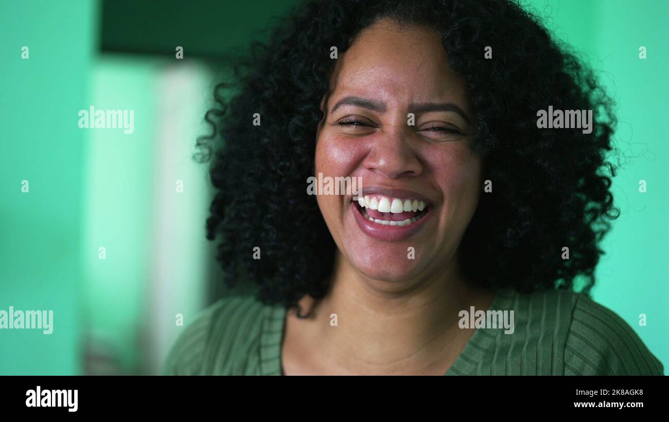 One young black woman laughing out loud portrait face real life laugh ...
