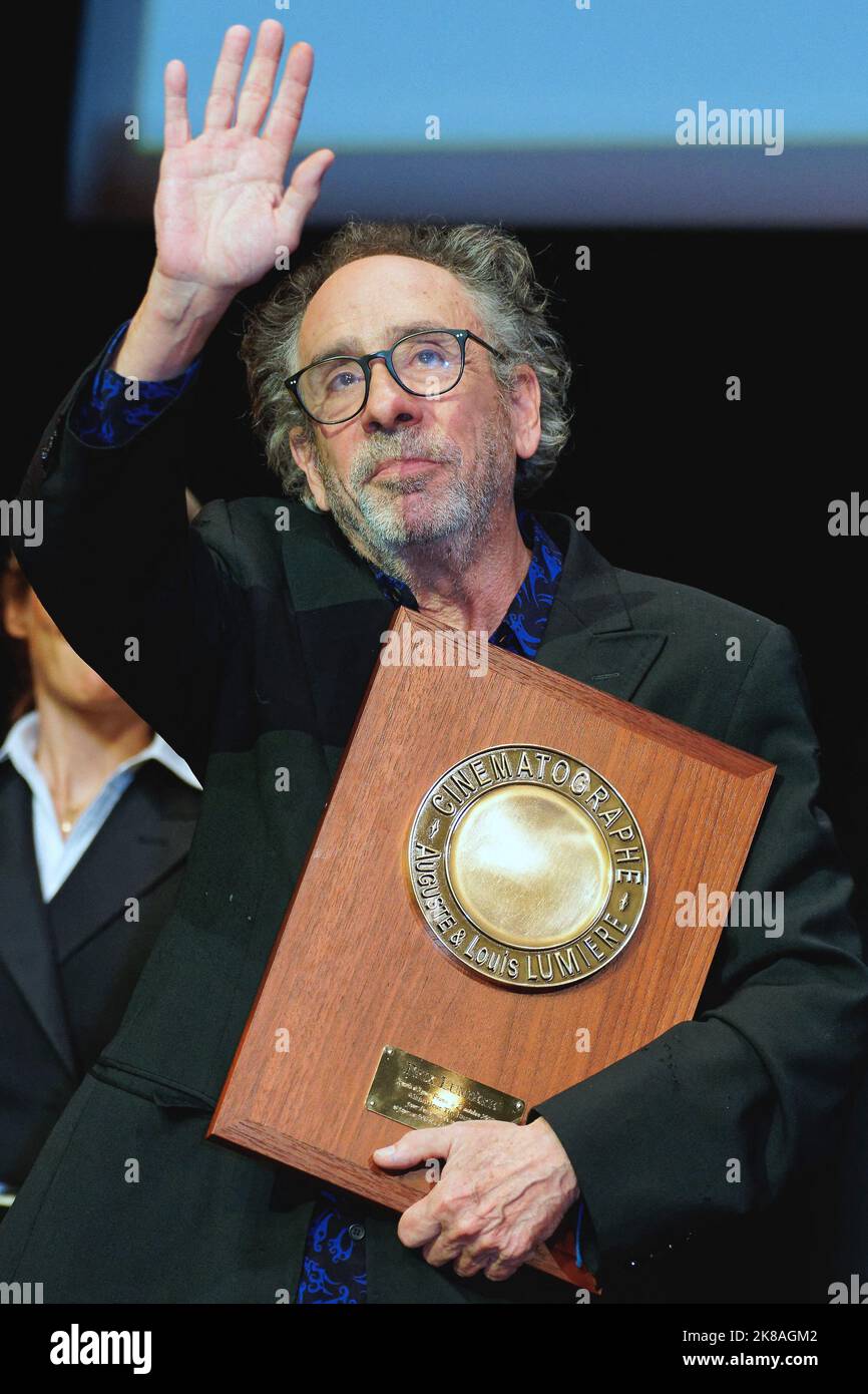 Tim Burton acknowledges the audience onstage the Lumiere Award ceremony ...