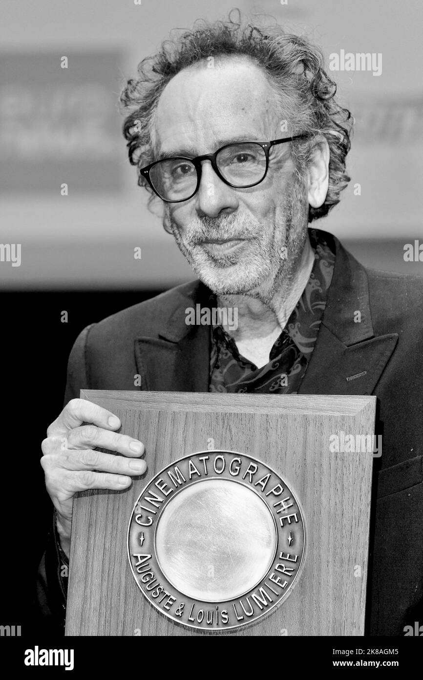Tim Burton acknowledges the audience onstage the Lumiere Award ceremony ...