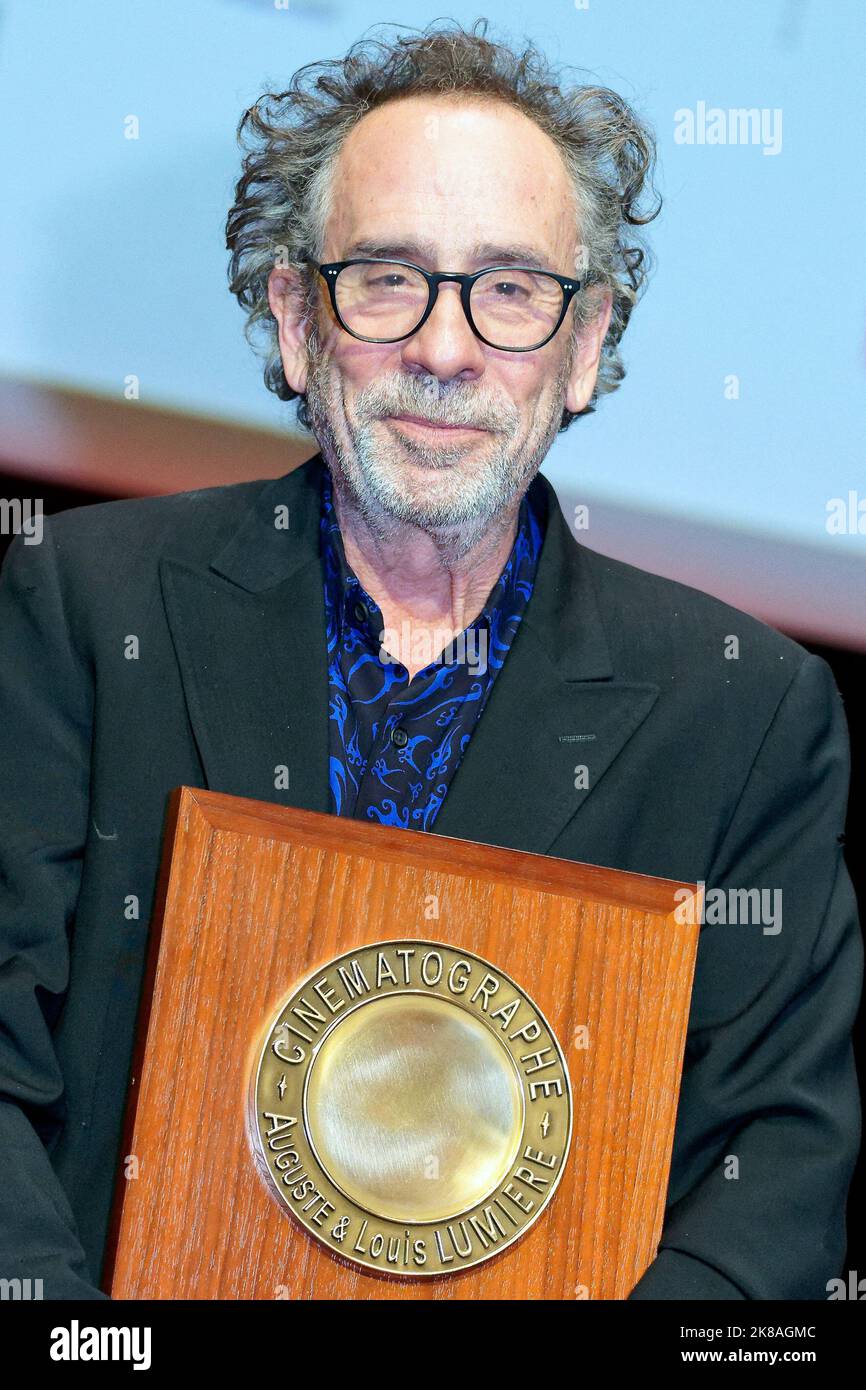 Tim Burton acknowledges the audience onstage the Lumiere Award ceremony ...