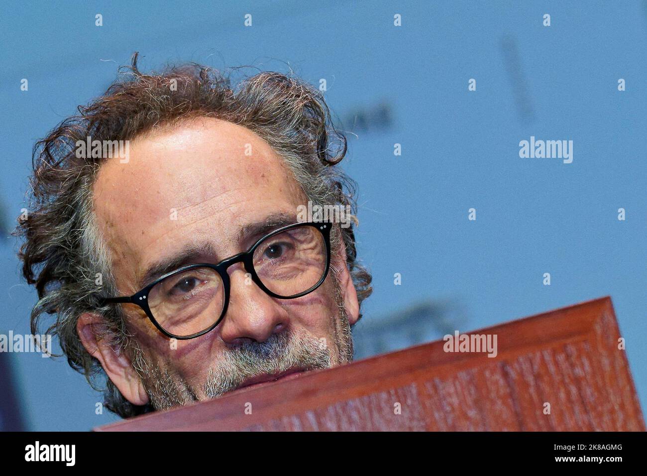 Tim Burton acknowledges the audience onstage the Lumiere Award ceremony ...