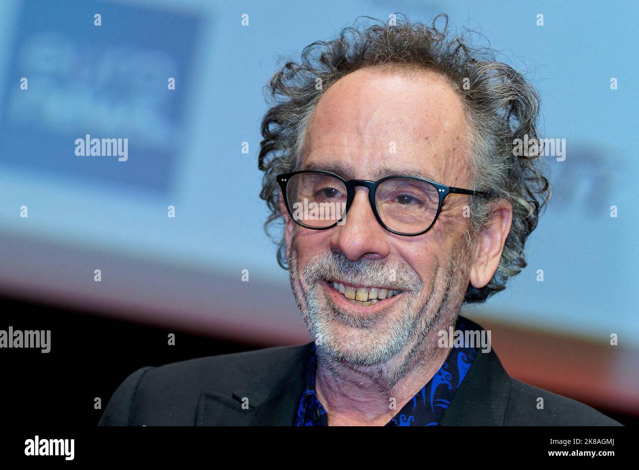 Tim Burton acknowledges the audience onstage the Lumiere Award ceremony ...