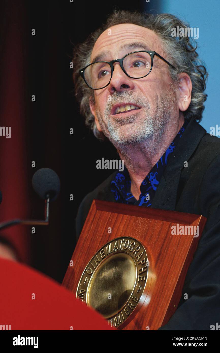 Tim Burton acknowledges the audience onstage the Lumiere Award ceremony ...