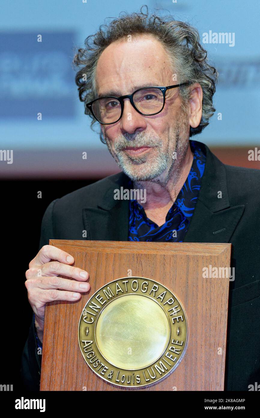 Tim Burton acknowledges the audience onstage the Lumiere Award ceremony ...