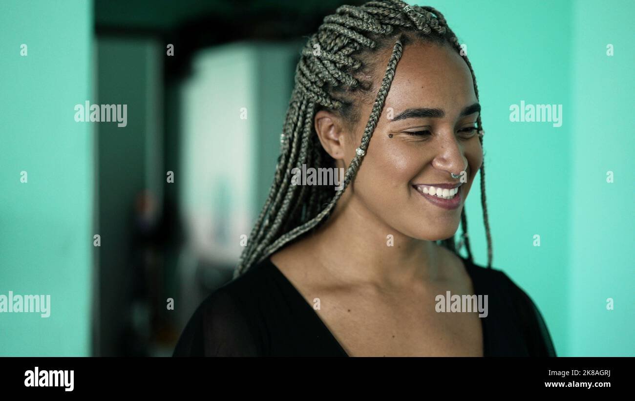 Portrait of a black latina woman with box draids hairstyle. A confident ...