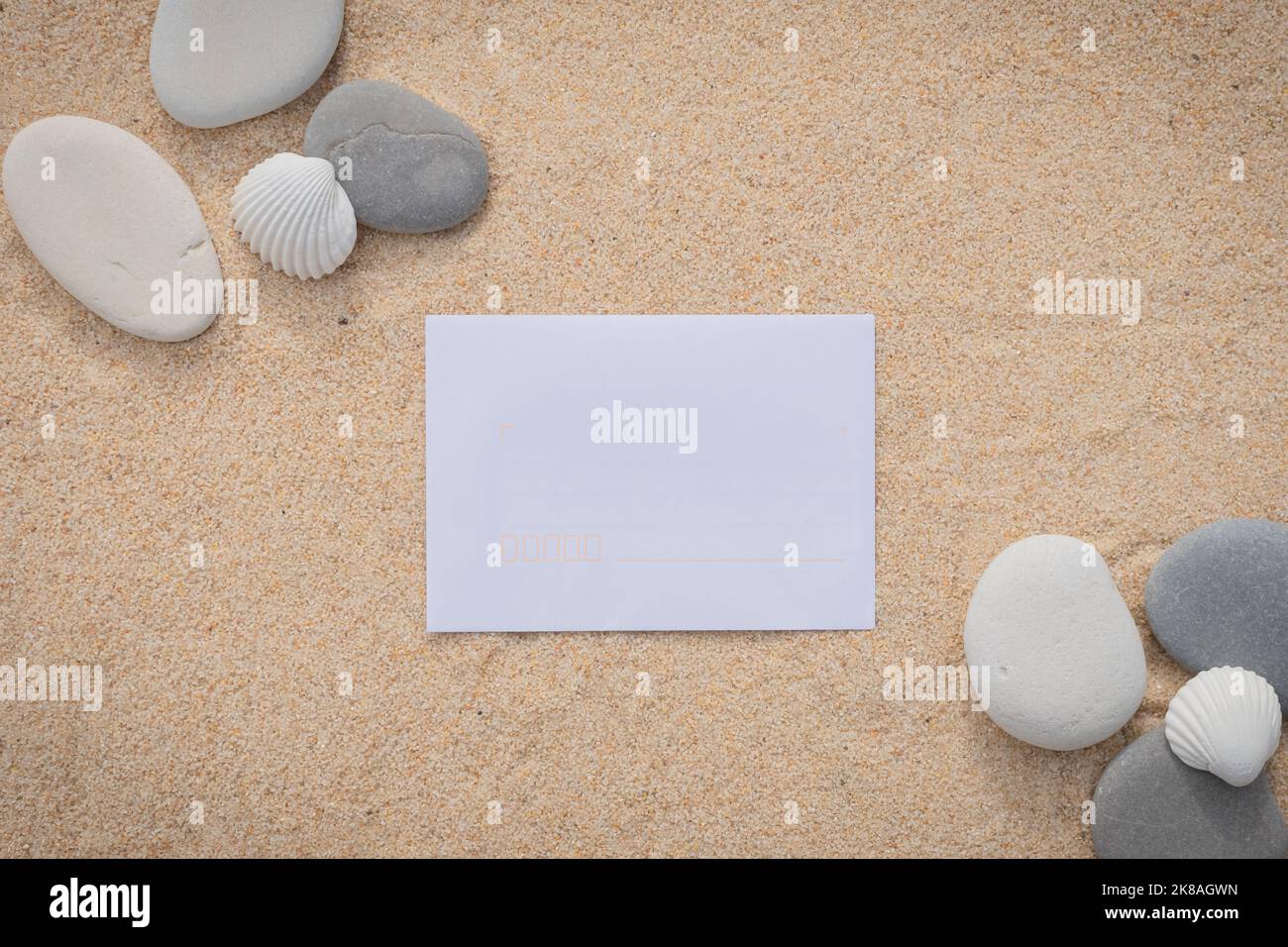 Background grains of sea sand, fine beach sand with envelope and pebble ...