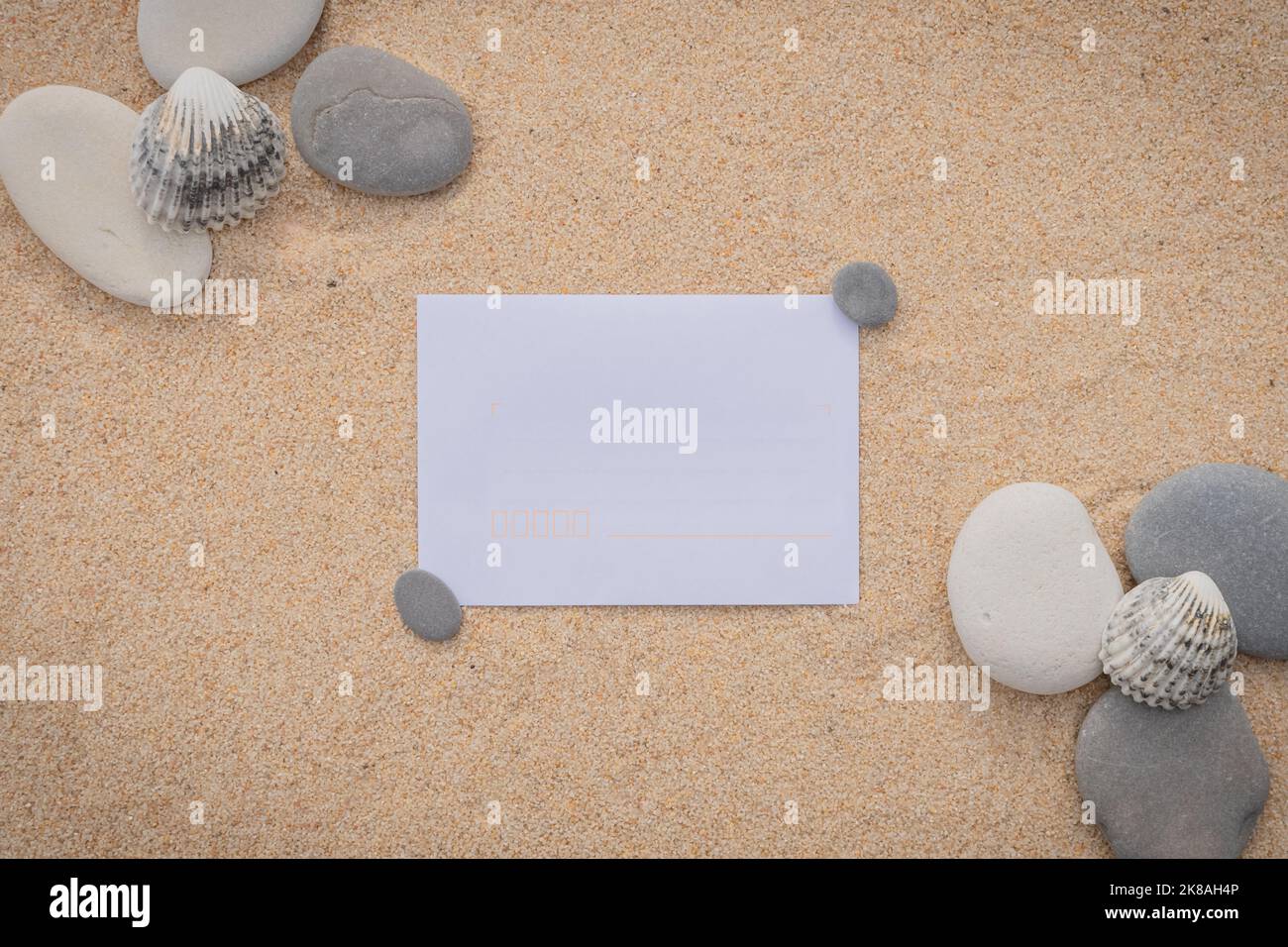 Background grains of sea sand, fine beach sand with envelope and pebble ...