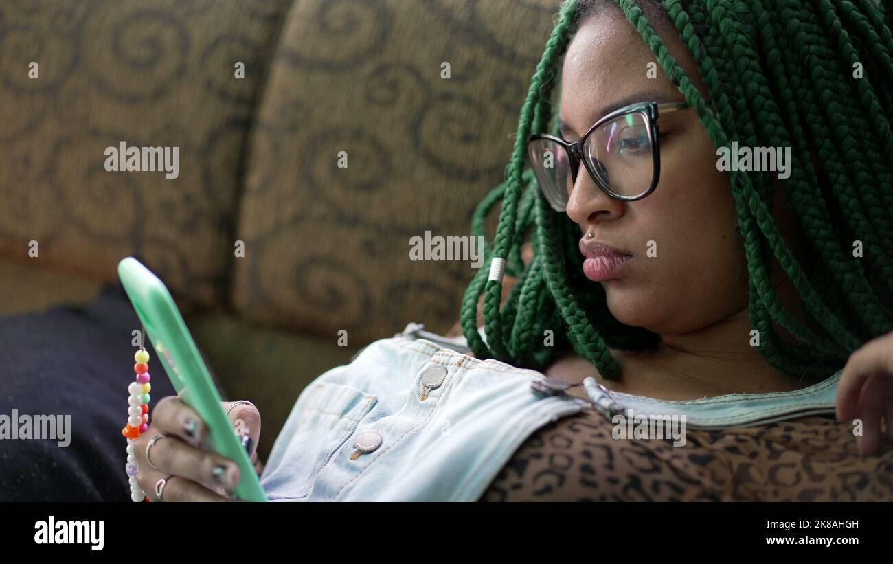 Slouched on sofa hi-res stock photography and images - Alamy