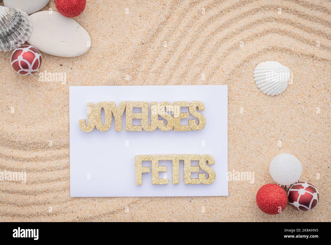 Background sea sand grains, fine beach sand with pebbles and Christmas ...