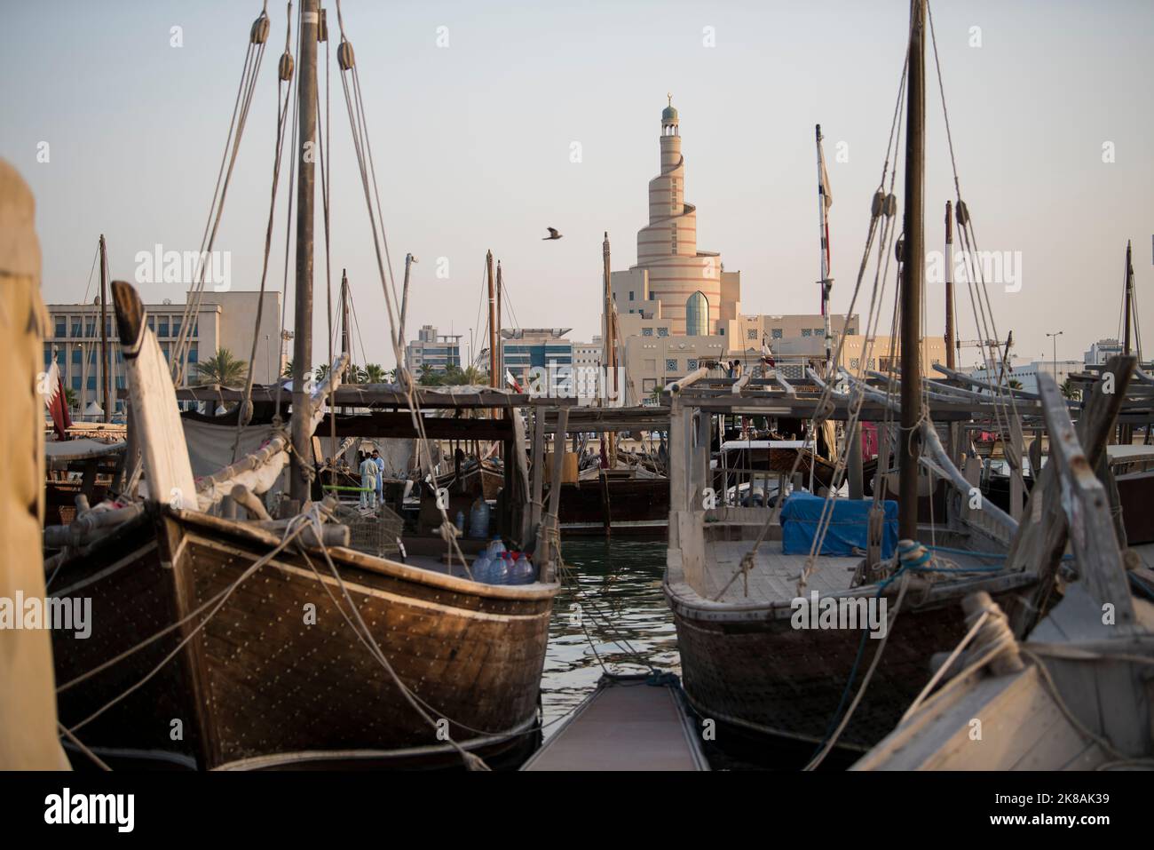 Doha,Qatar- April 24,2022 Traditional boats called Dhows are anchored ...