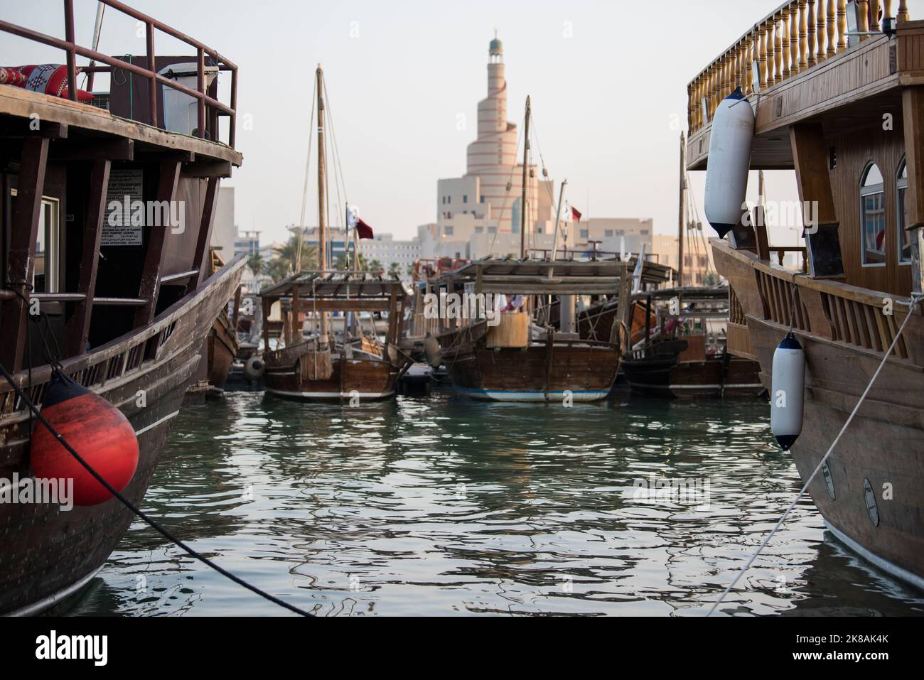 Doha,Qatar- April 24,2022 Traditional boats called Dhows are anchored ...