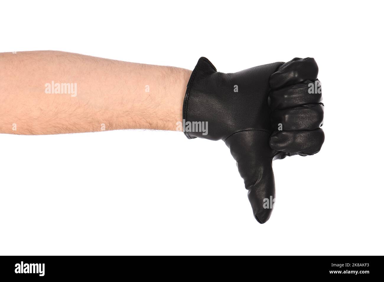 Man wearing black leather glove on white background, closeup. Thumb ...