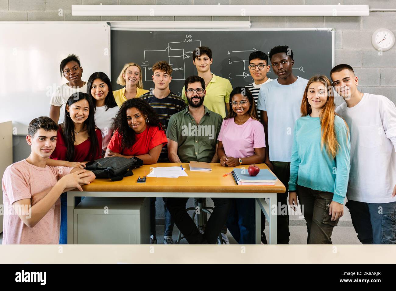 Teacher posing in her classroom hi-res stock photography and images - Alamy
