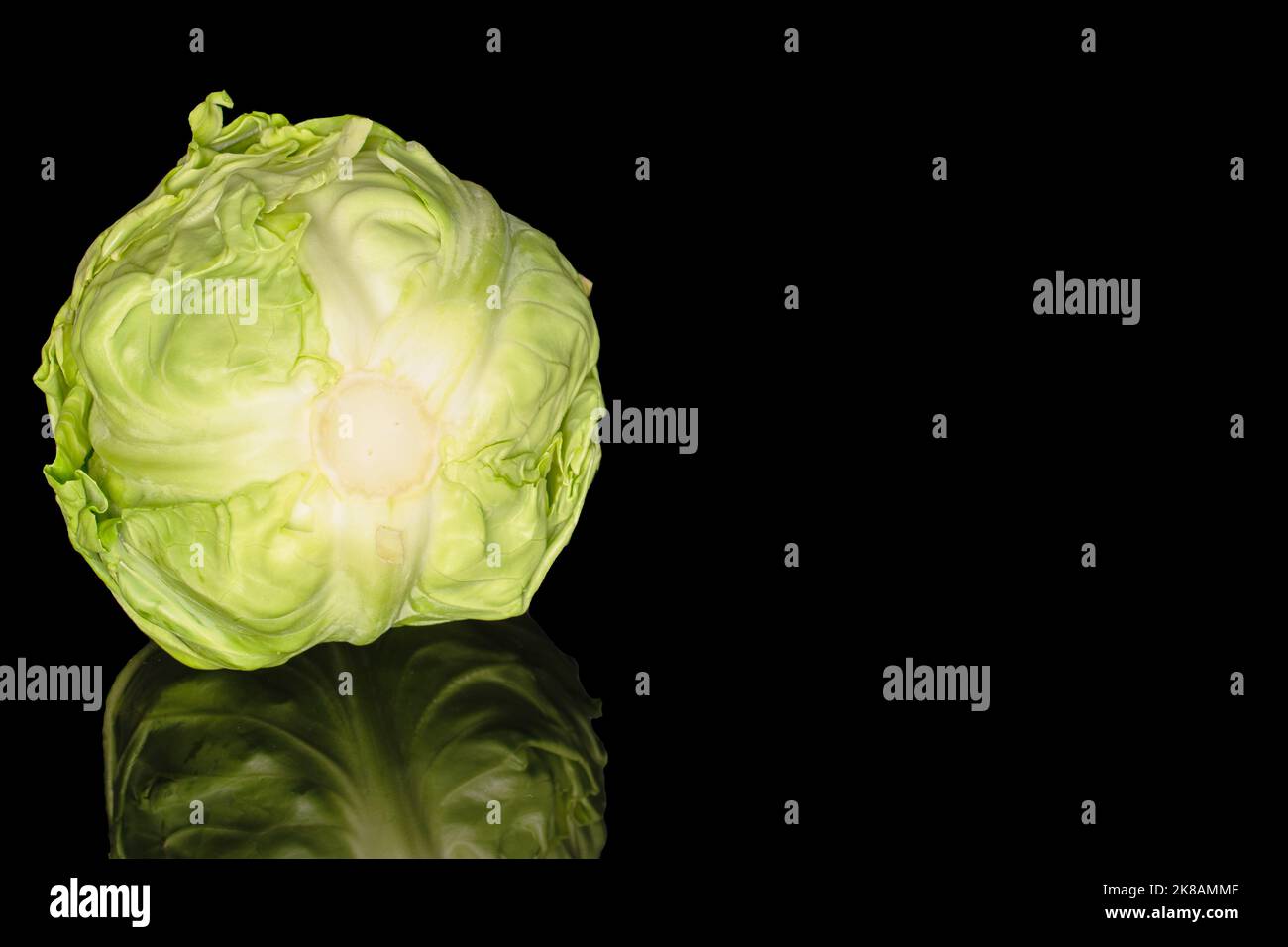 One head of fresh cabbage, macro, isolated on black background Stock ...
