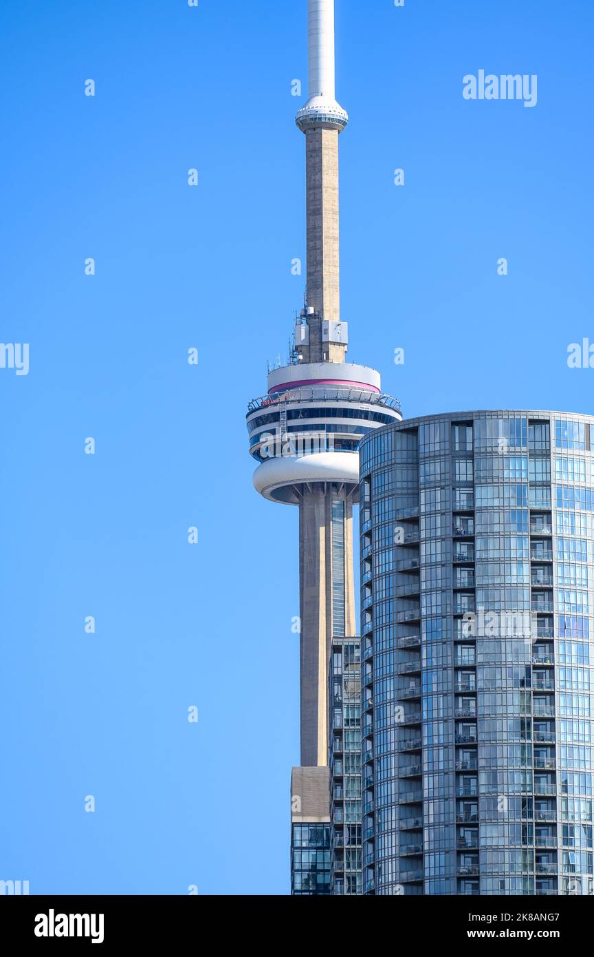 The CN Tower is framed in a modern design architecture of an apartment ...