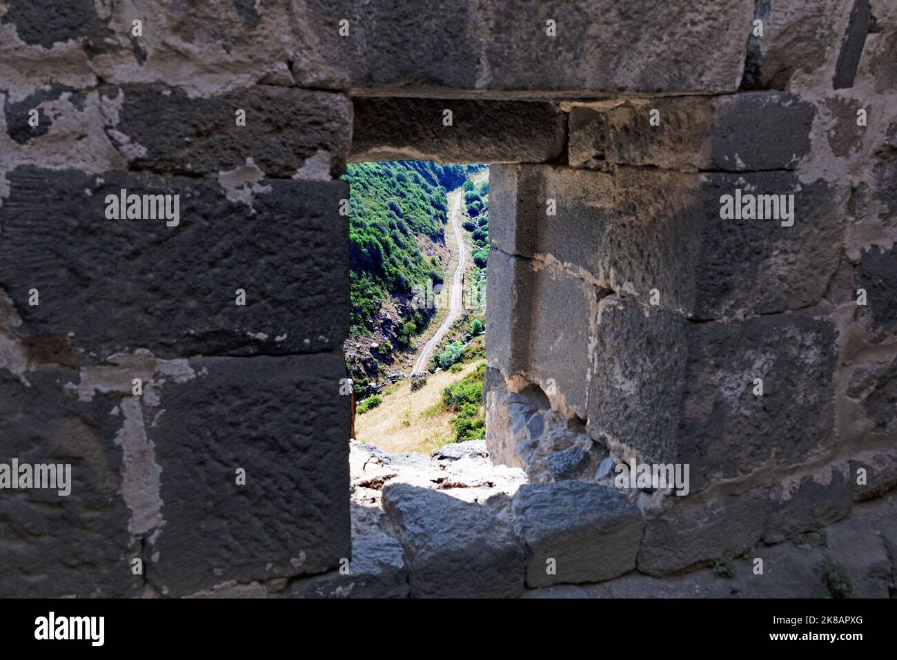 View of the forest road from above, through the Amberd fortress window ...