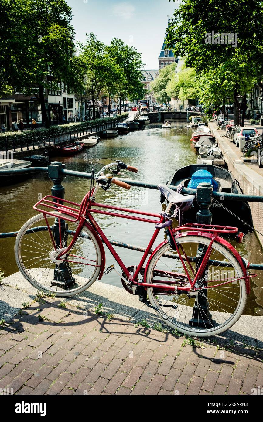 Amsterdam canal with red boat hi-res stock photography and images - Alamy