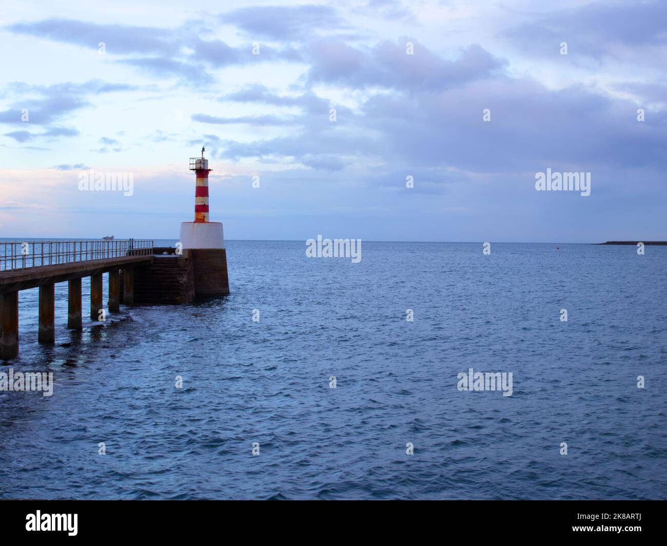 The lighthouse at Amble, Northumberland at sunset Stock Photo - Alamy