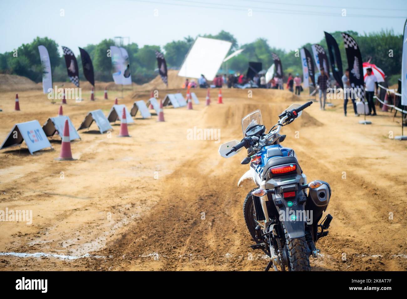 Bike standing in front of bike track with blurred people watching in ...