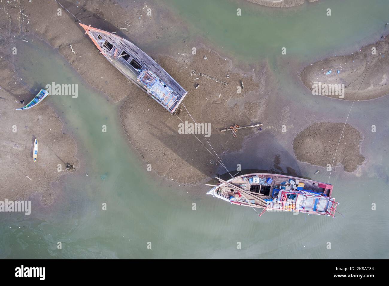 Aceh, Indonesia. October 22, 2022. Two damaged boats need repair and ...