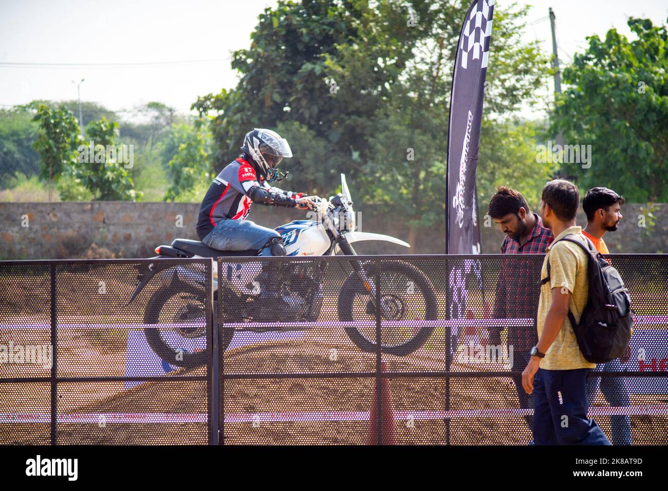 spectators watching off road bike racing event with xpulse bike going ...