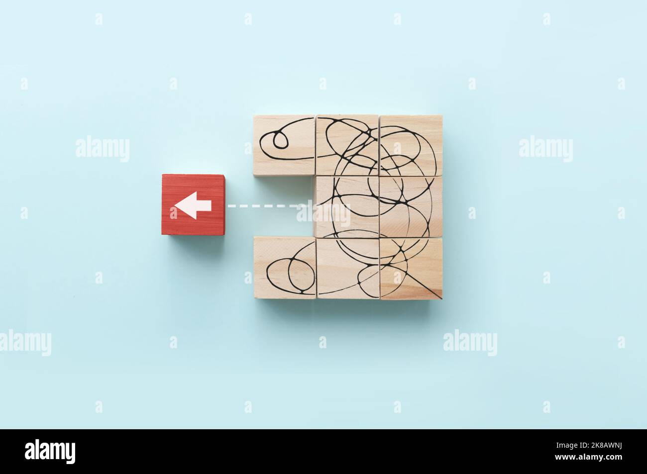 Messy line sketched on wooden blocks leading to arrow, solving complex ...