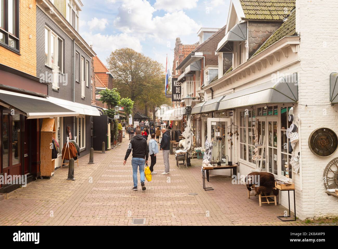 Cozy shopping street in the center of the small tourist village of Den ...