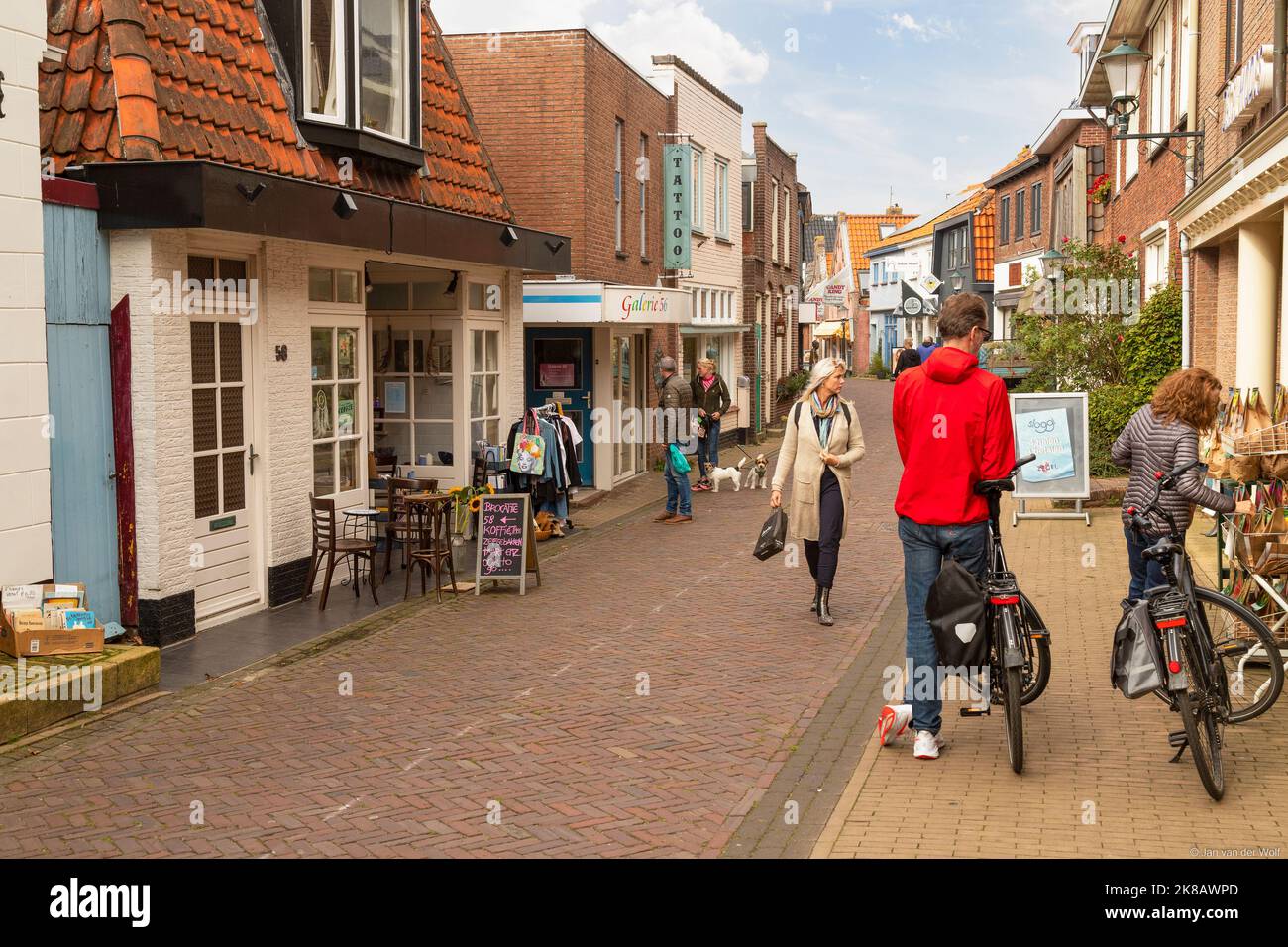 Cozy shopping street in the center of the small tourist village of Den ...