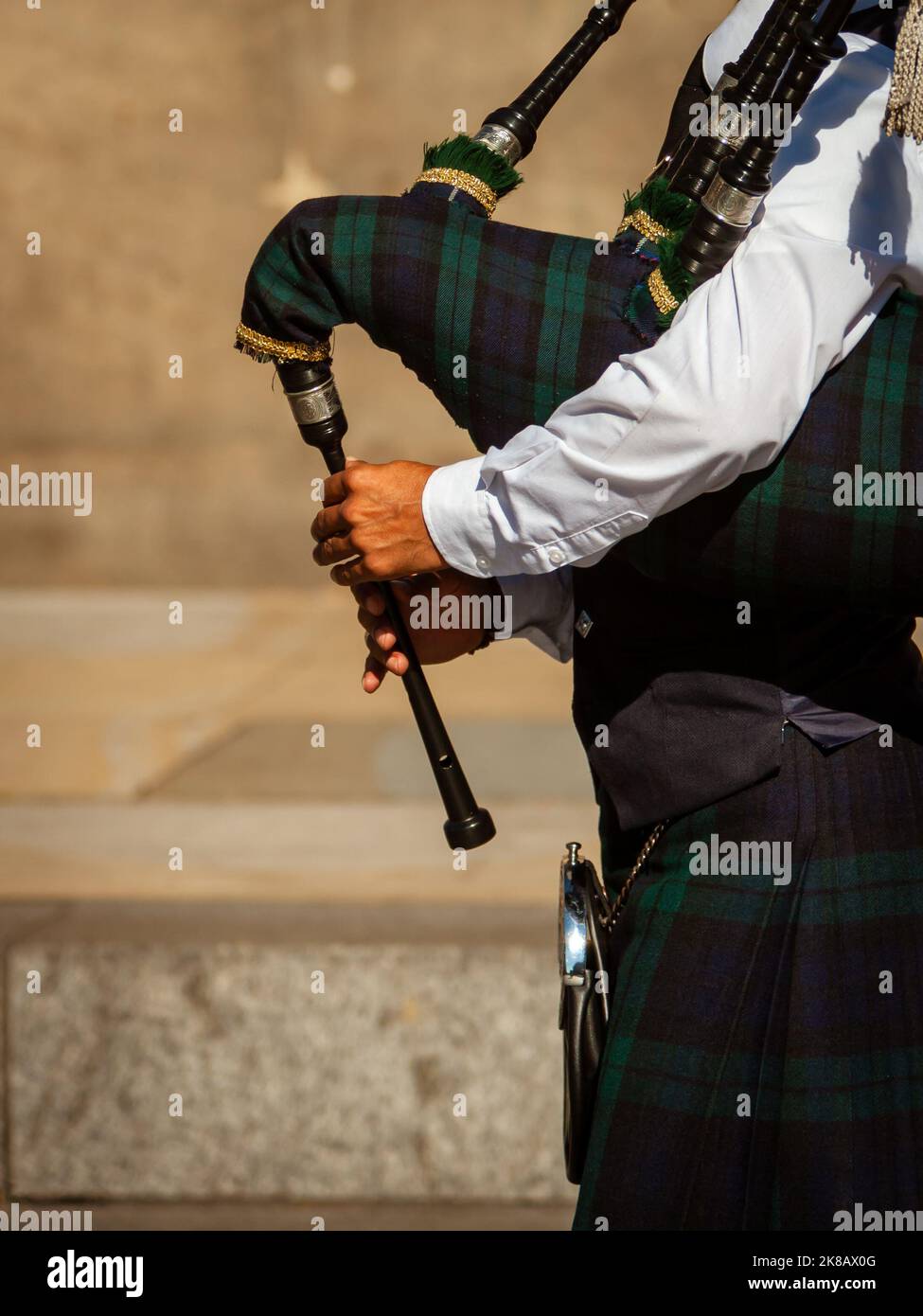 A bagpiper is playing pipes Stock Photo - Alamy