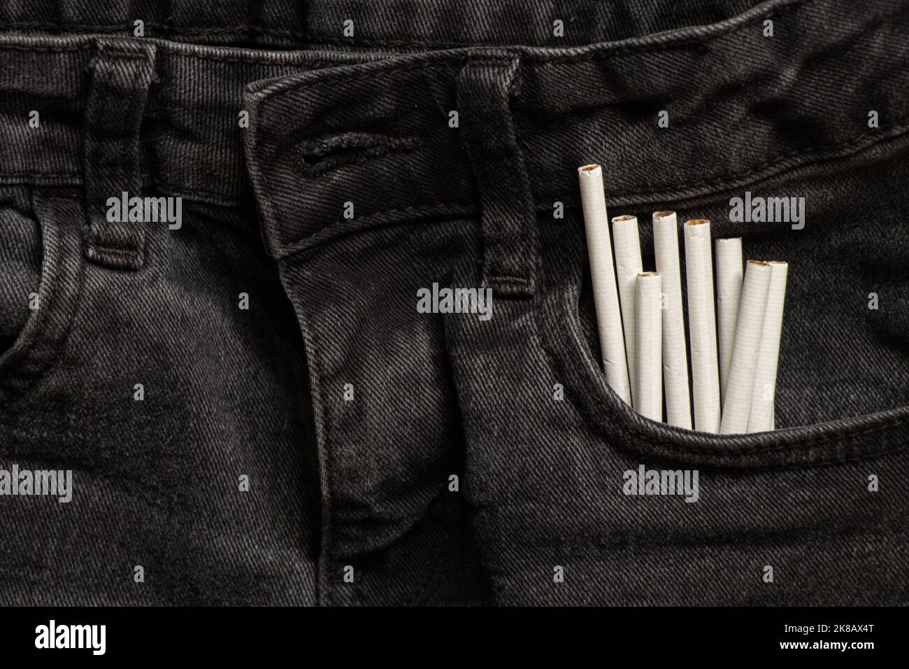 cigarettes in a pocket in gray jeans, cigarette addiction and fashion ...