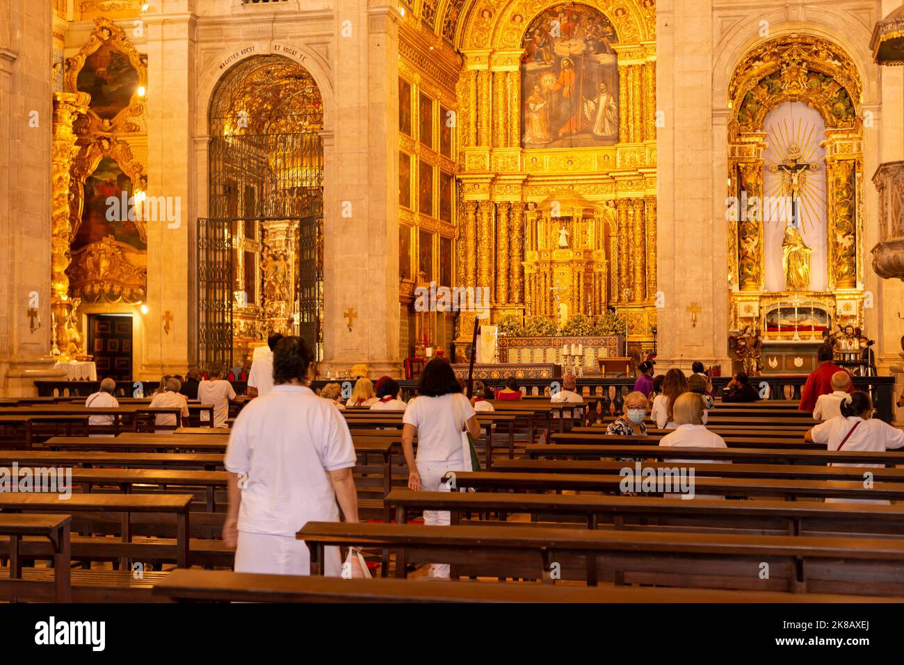 Salvador, Bahia, Brazil - June 16, 2022; Catholics and priests praying inside the basilica ...