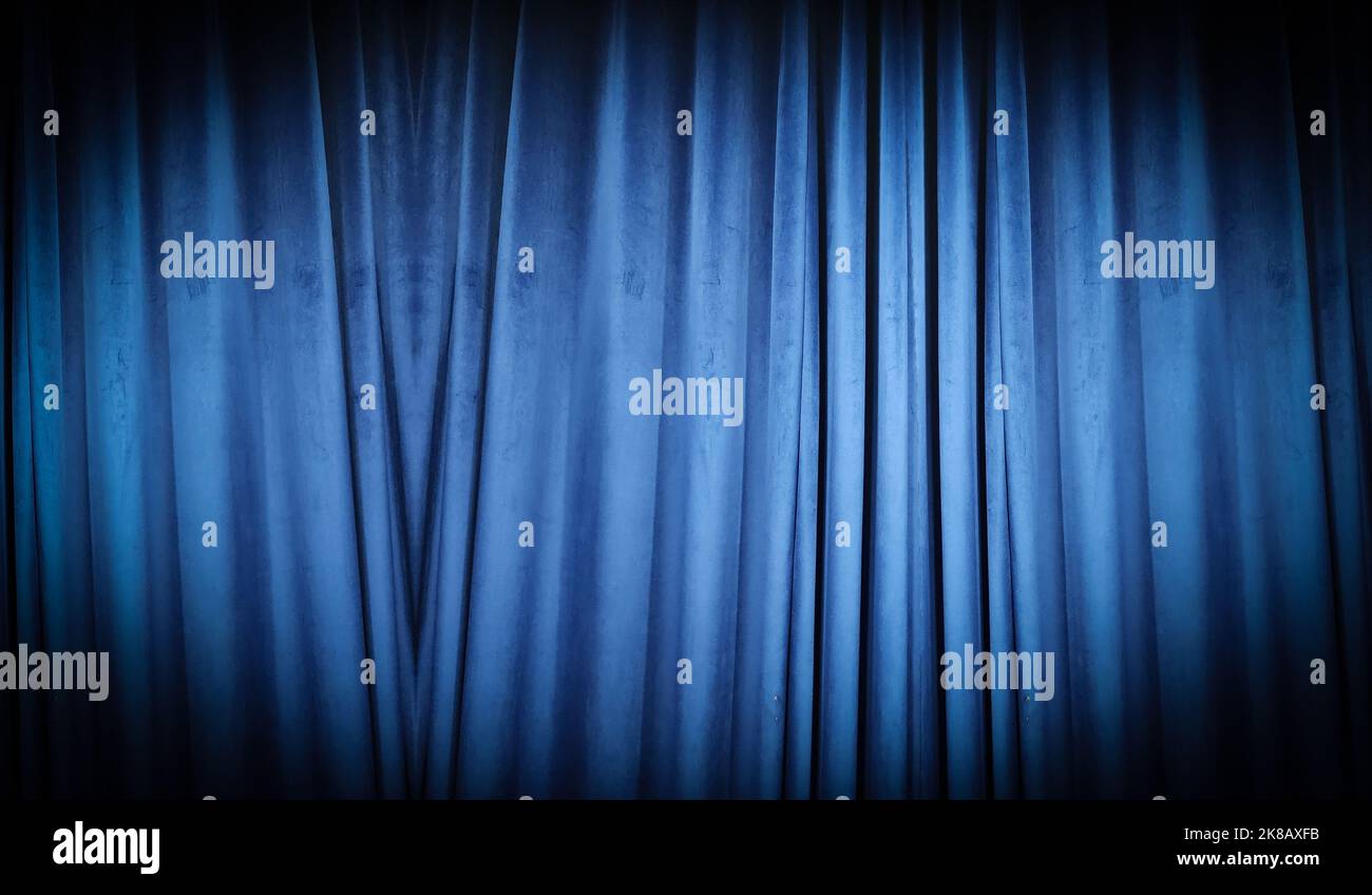 Blue curtain fabric making a dark banner background Stock Photo - Alamy