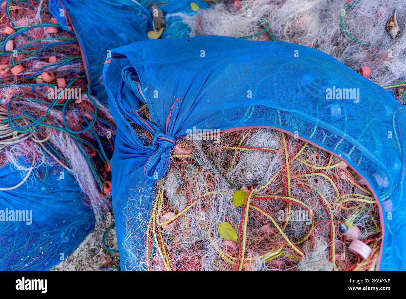 A blue fishing net is seen packed Stock Photo - Alamy