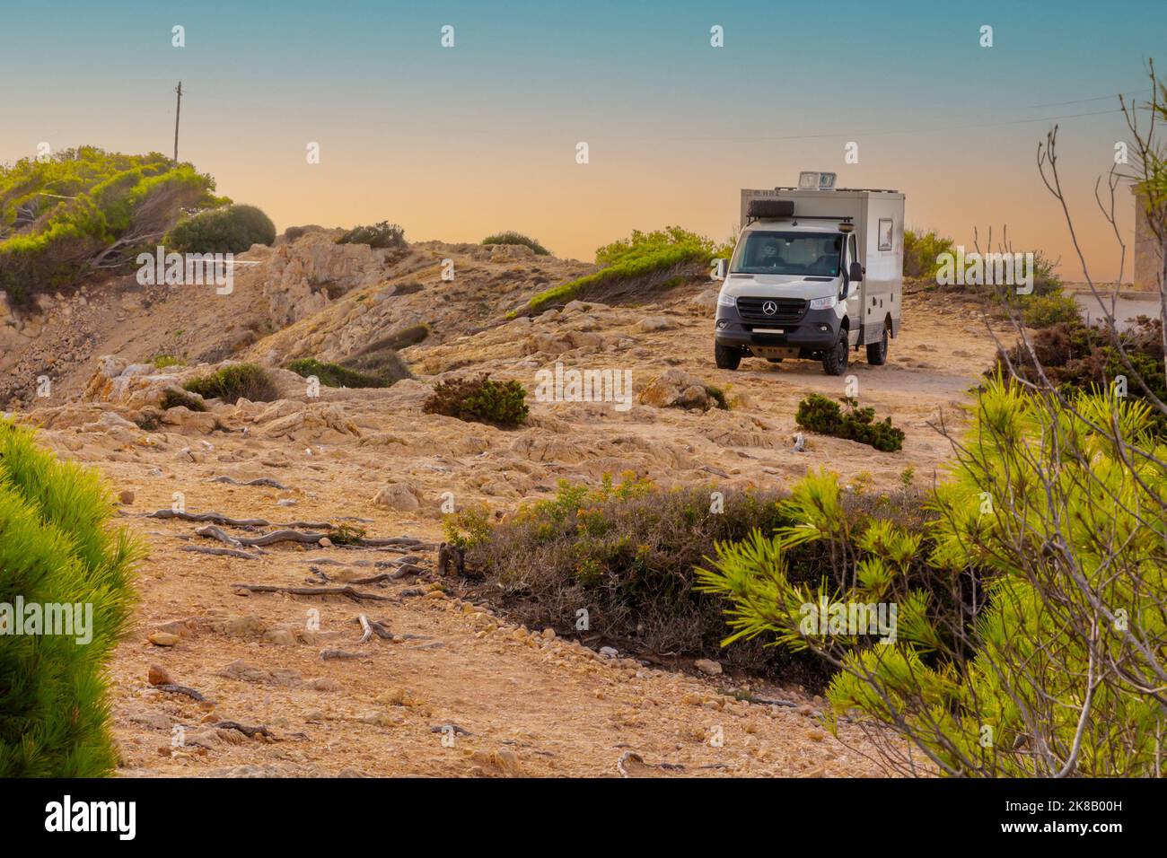 offroad camping vehicle Detached in Mallorca on the coast on cliffs ...