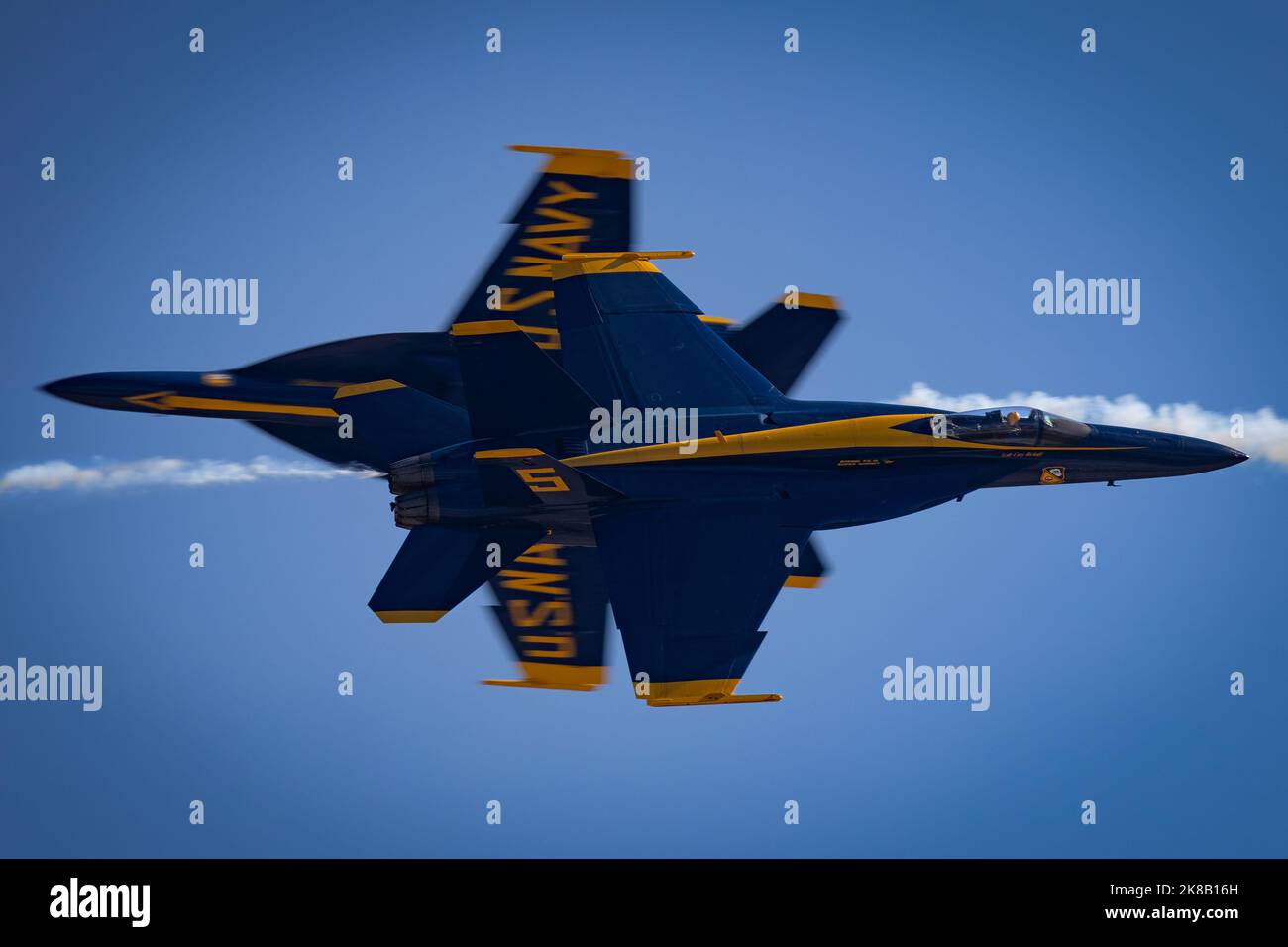The Opposing Solos of the US Navy Blue Angels cross at show center ...