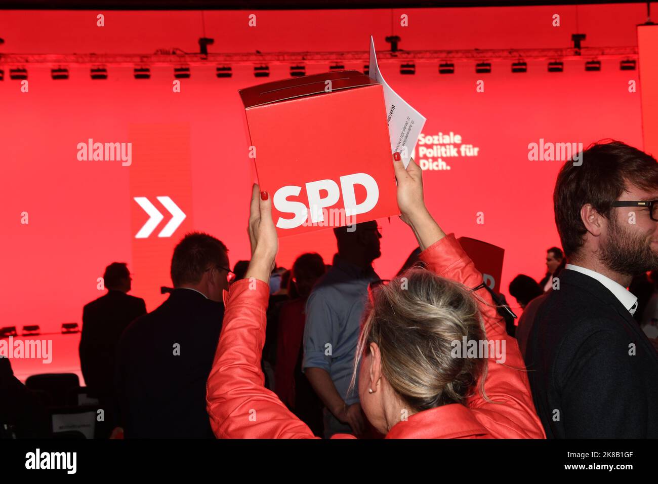 Munich, Germany. 22nd Oct, 2022. A ballot box is held aloft at the ...