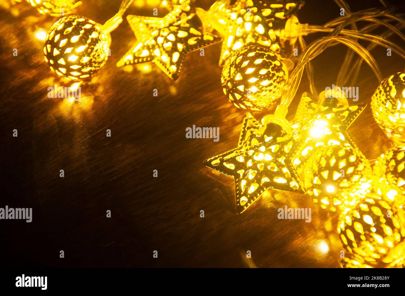 Season's greetings text with Christmas golden balls and starts light ...
