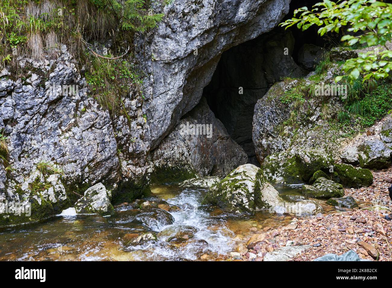 River flowing into a cave in a karst system in the limestone mountains ...