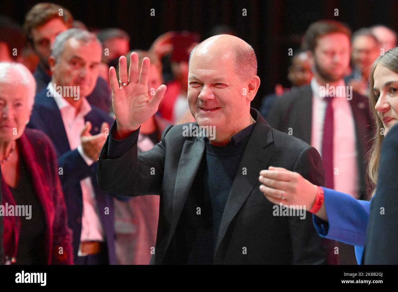 Munich, Germany. 22nd Oct, 2022. Chancellor Olaf Scholz waves at the ...