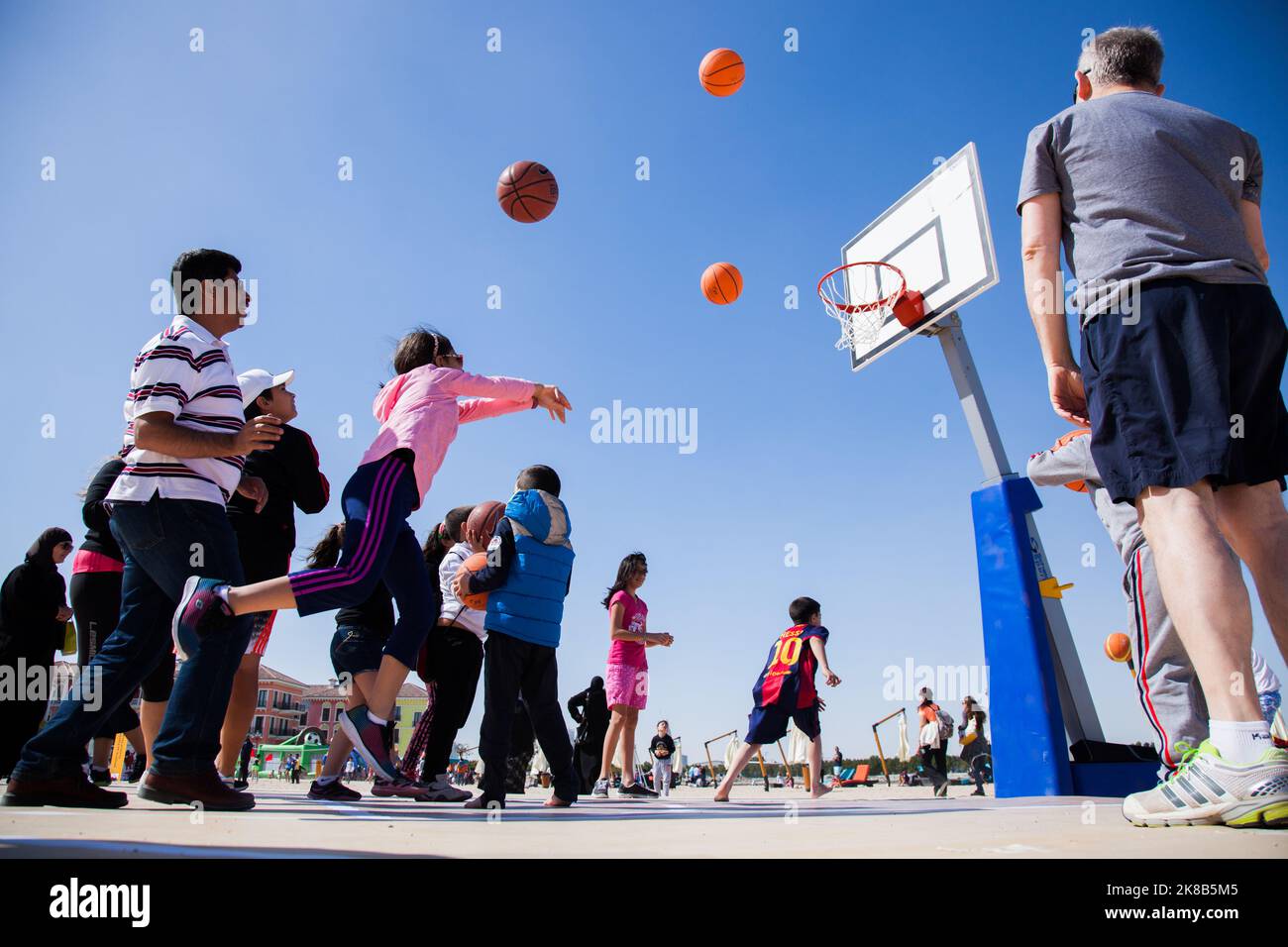 Doha ,Qatar-February 14,2016 : Local people enjoy basketball at an ...
