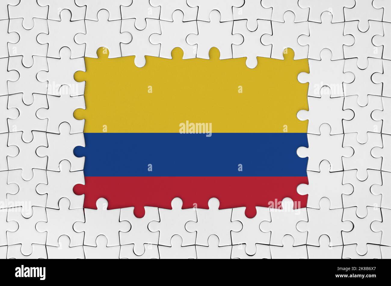 Colombia flag in frame of white puzzle pieces with missing central ...