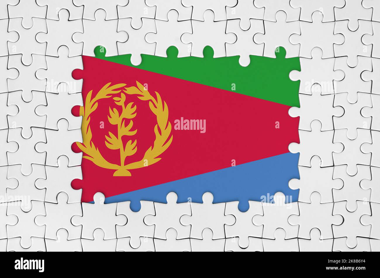 Eritrea flag in frame of white puzzle pieces with missing central parts ...