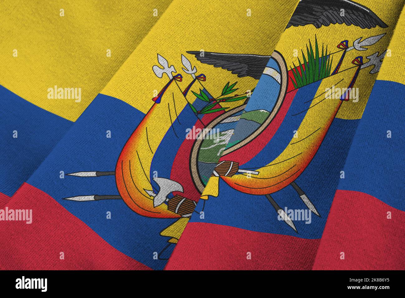 Ecuador flag with big folds waving close up under the studio light ...
