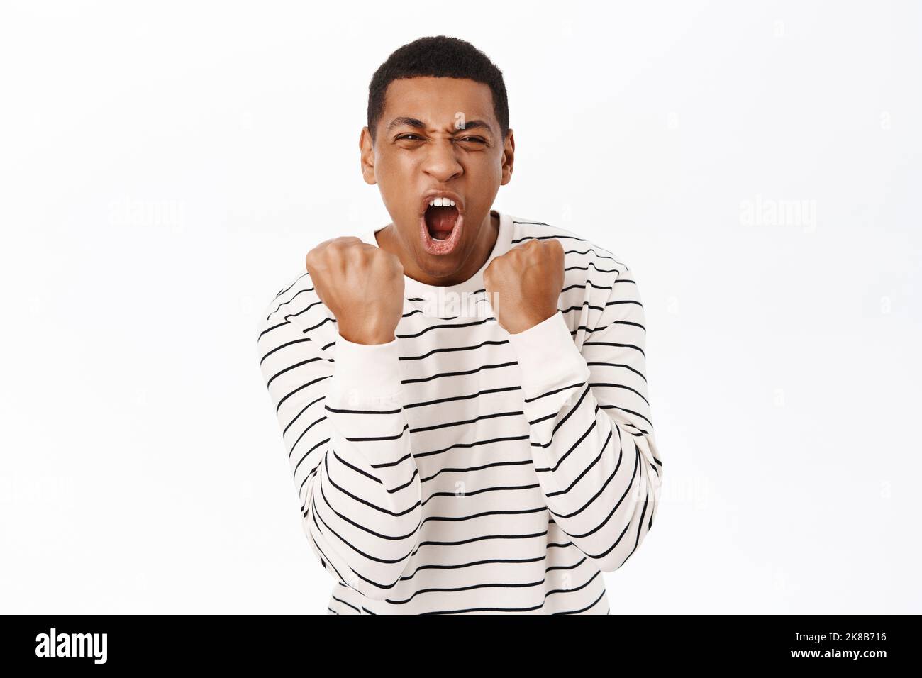 Success and achievement. Enthusiastic man winning, celebrating victory ...